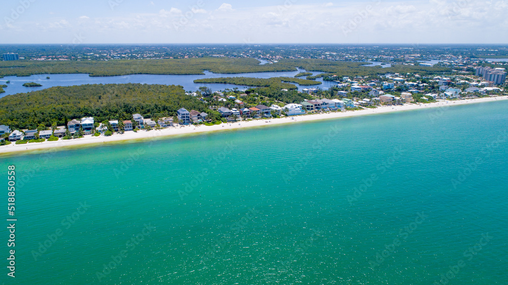 Aerial Drone View of the Coast of Bonita Springs, Florida with Barefoot ...