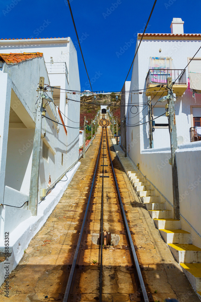 Nazare, Portugal: the narrow passage between buildings on the Nazare ...