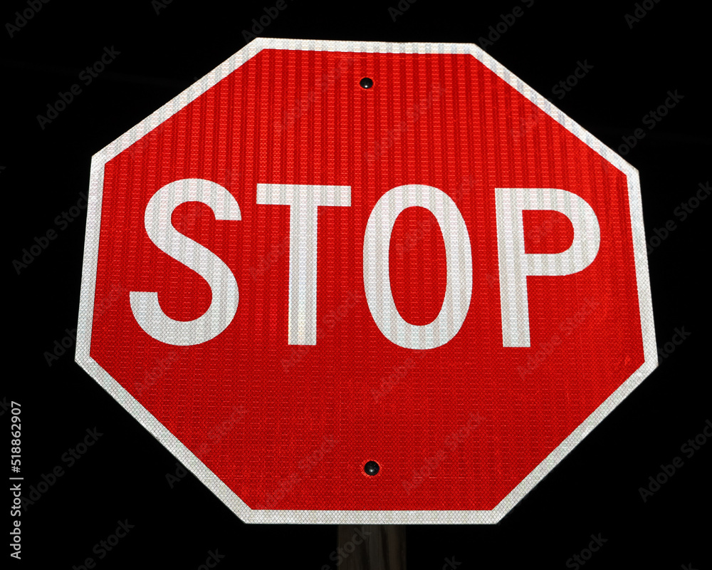 A stop sign with dark sky background. Stock Photo | Adobe Stock