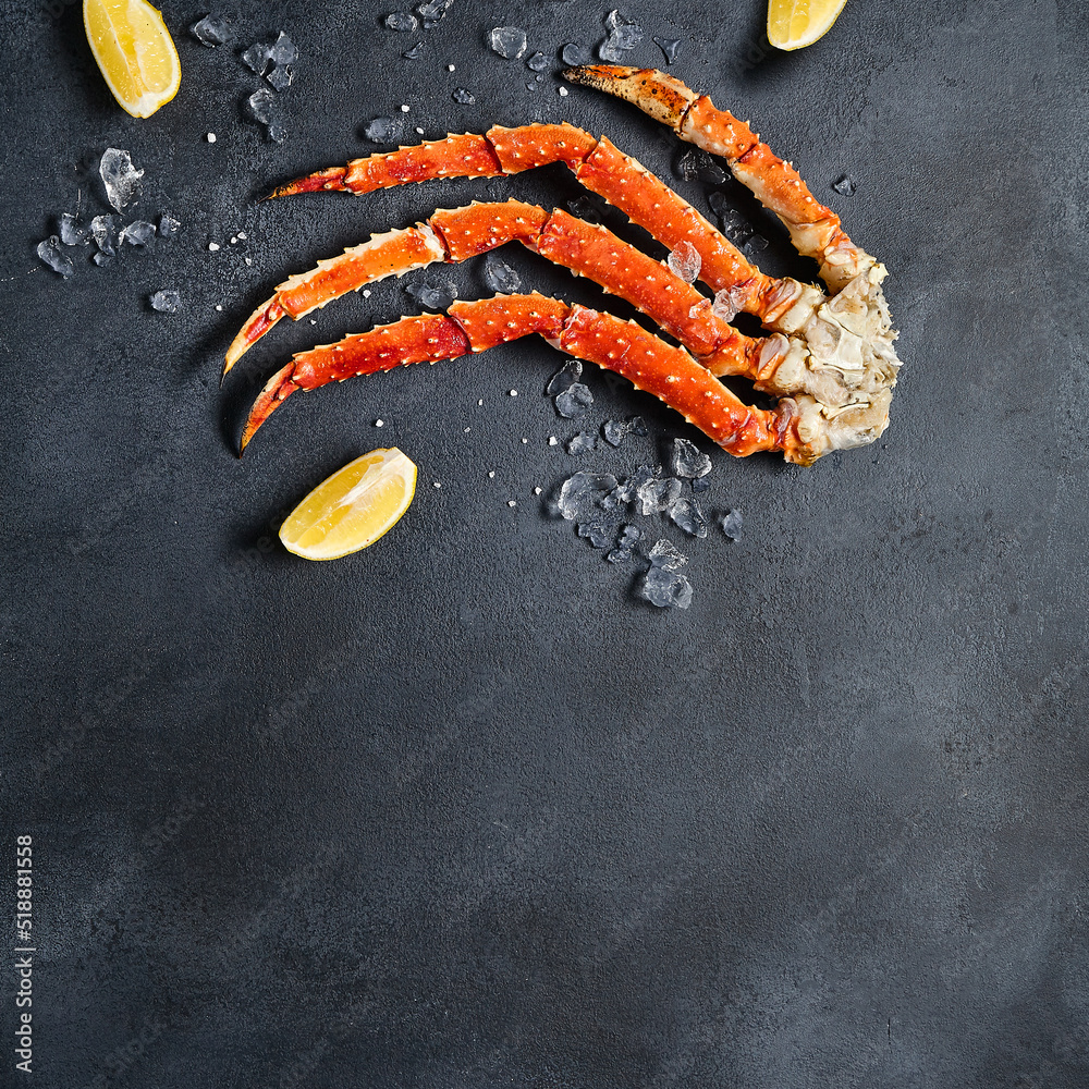 Crab legs top view on dark background. Delicatessen crab seafood on ...