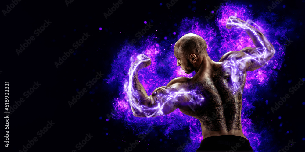 Muscular body builder lifting weight with energy lights on biceps ...