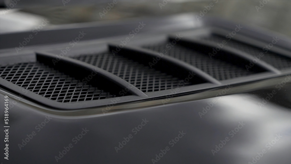 Fotka „Close up for detail of air vents on the bonnet of a modern black ...