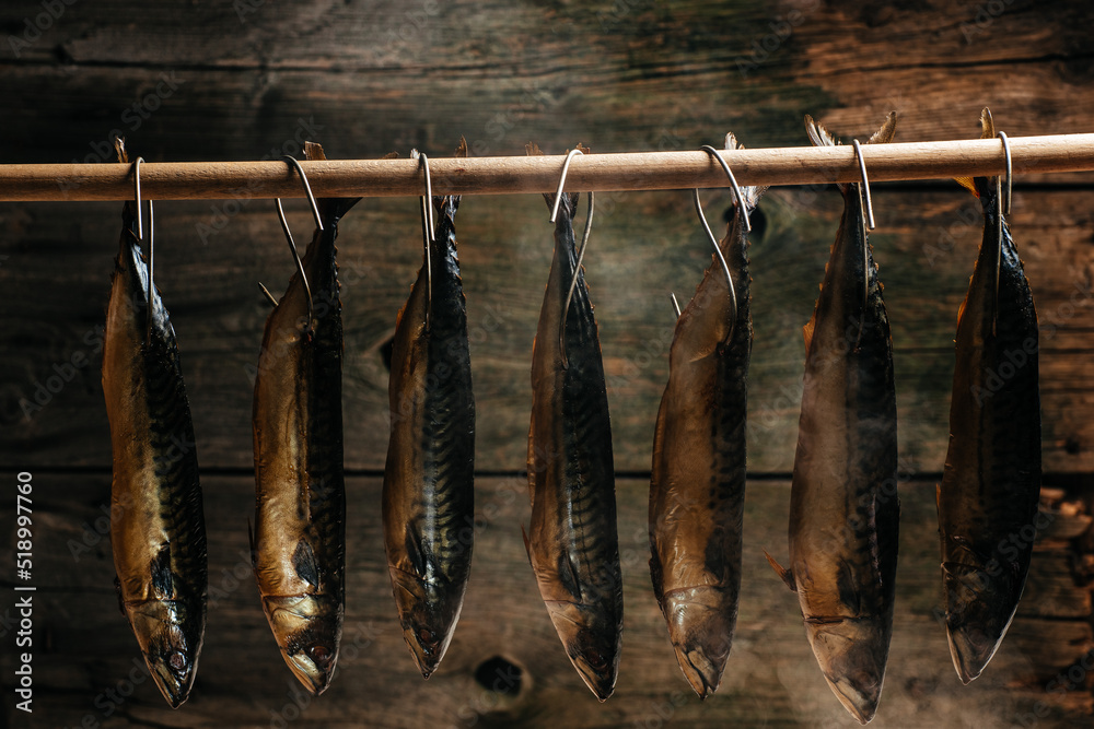 Fish Smoking Process For Home Use. fish hanging side by side in a ...