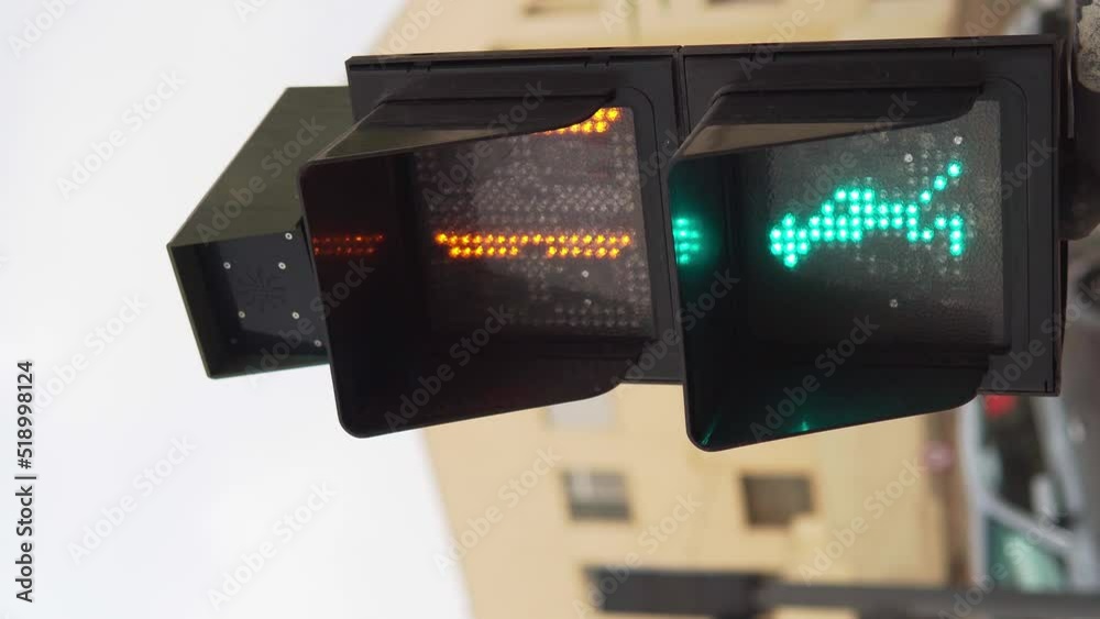 Vertical close up view of a pedestrian traffic lights sign. Green light ...