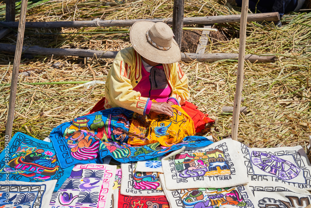 Traditional woman weaving fabrics on Floating islands Titicaca lake ...