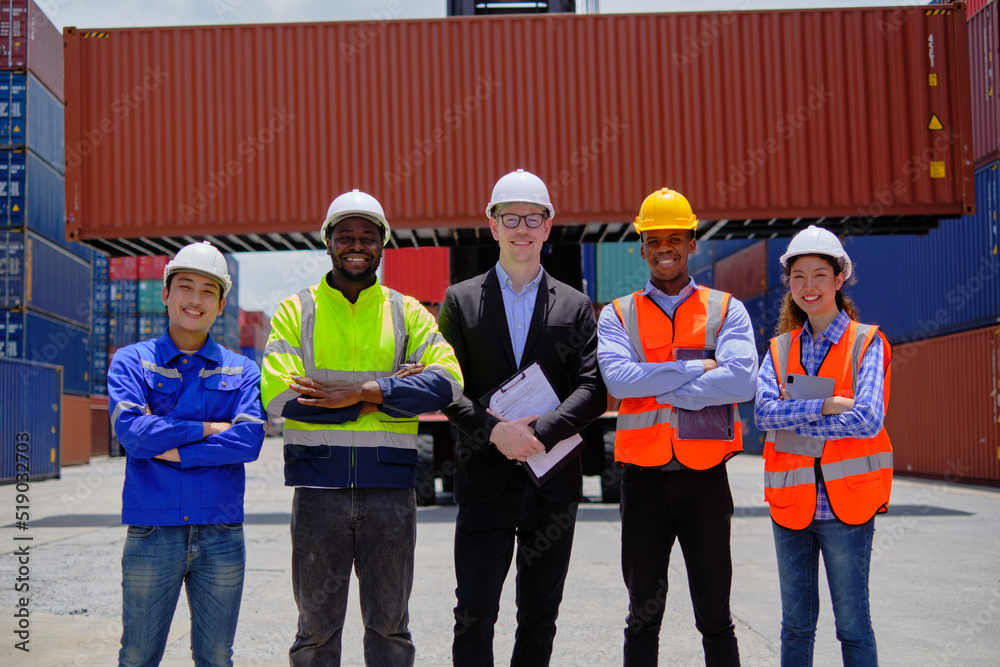 Group of multiracial workers team in safety uniforms, arms crossed and ...