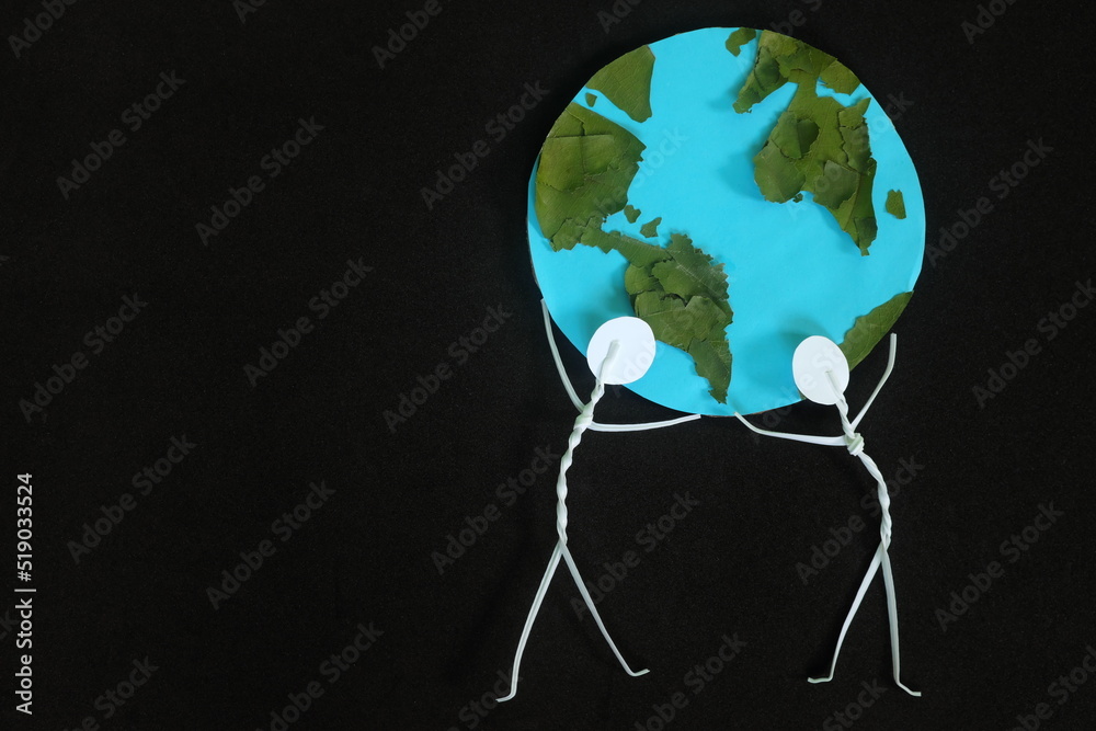 Two human stick figure man carrying the earth on shoulders on dark ...