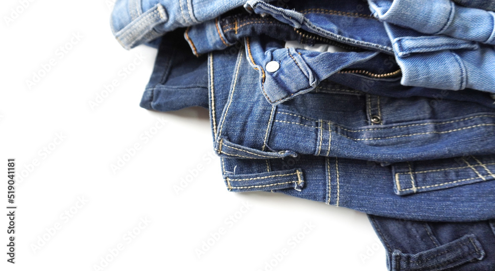 Denim jeans of different shades on white background banner with copy ...
