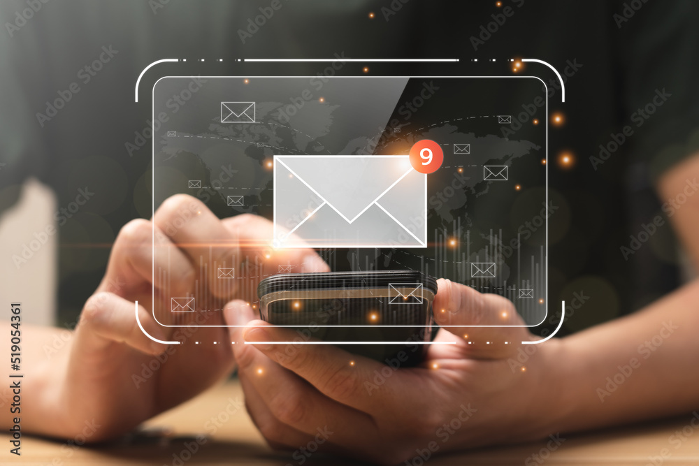 email marketing concept. Businessman checking email on mobile phone ...