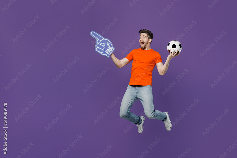 Full body young fun fan man he wear orange t-shirt cheer up support ...