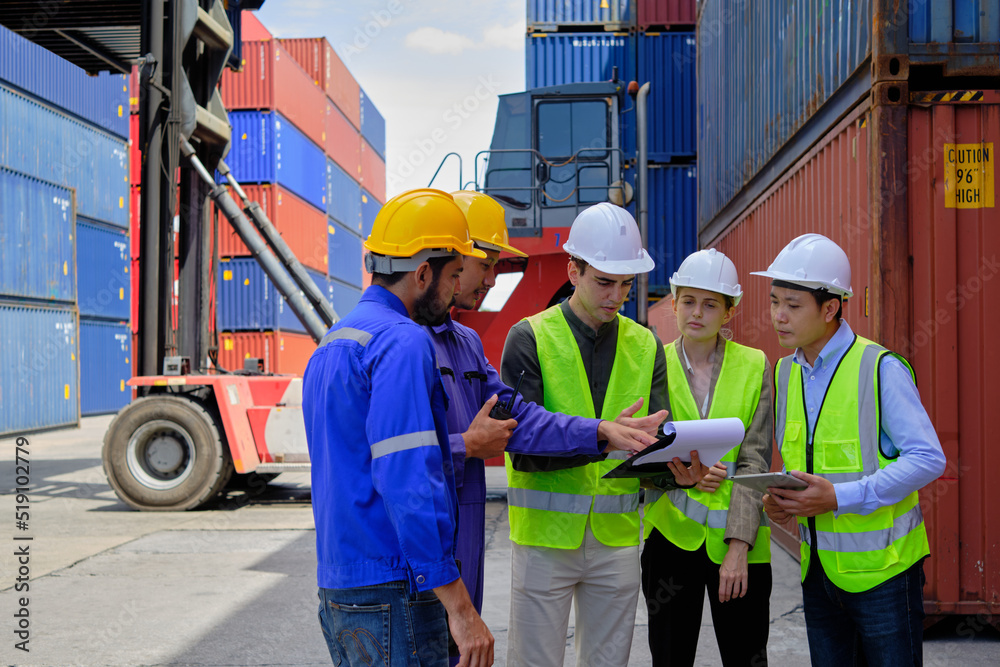 A Group of multiracial workers people in safety uniforms and hardhats ...