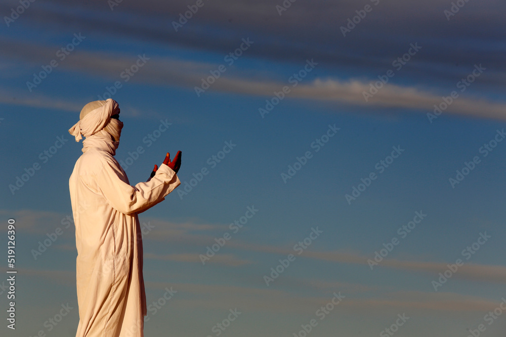 Beduin praying in the Sahara Stock Photo | Adobe Stock
