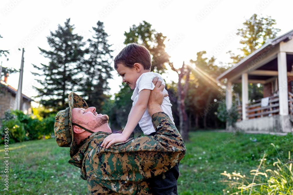 Photo of young soldier man meeting his son after a long time spent on ...