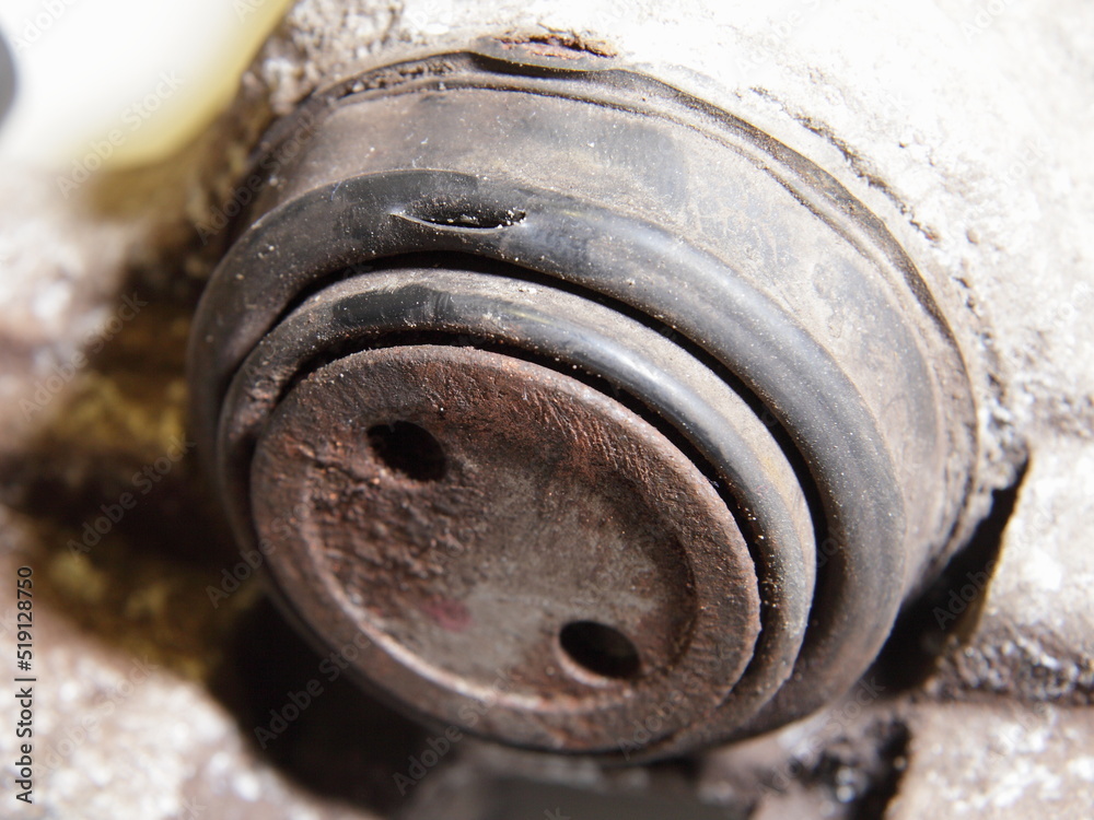 Destroyed brake piston cup close up, old car hydraulic brake cylinder ...