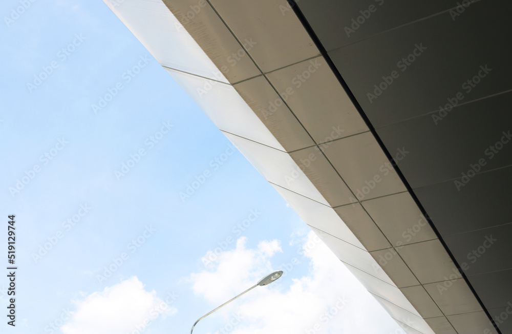 Aluminium composite cladding finishing on ceiling roof sky background ...