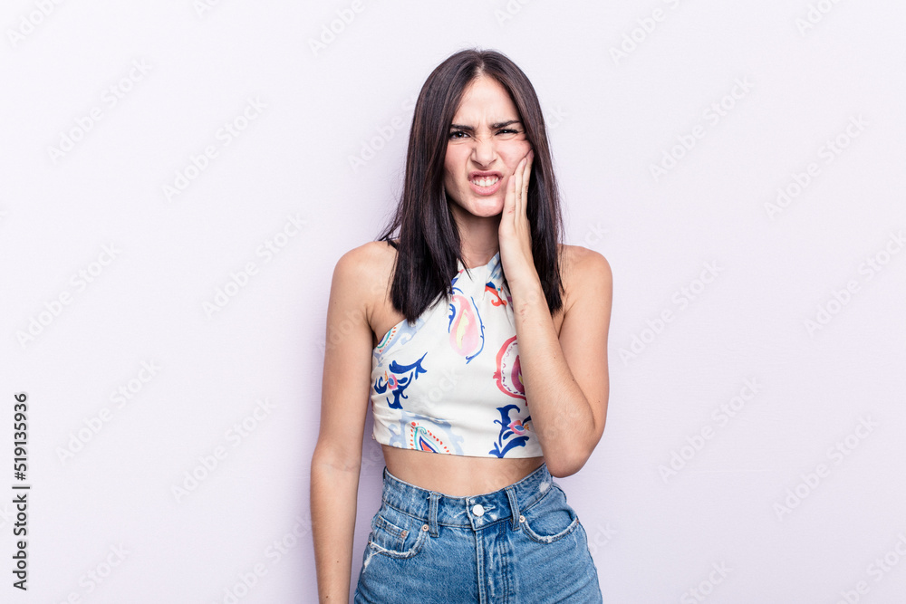 Young caucasian woman isolated on pink background having a strong teeth ...