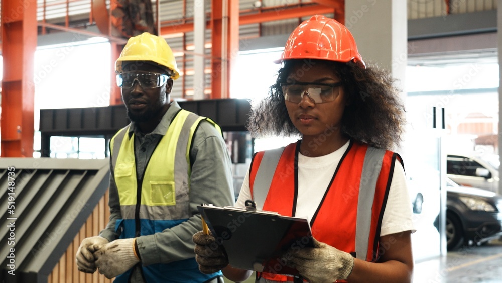 Two engineer worker together, Woman talking and pointing with Man. Two ...