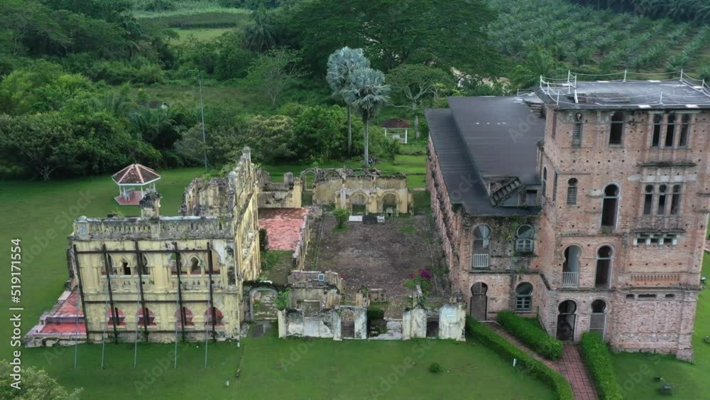 Reverse reveal shot capturing British colonial ruins, riverside ...