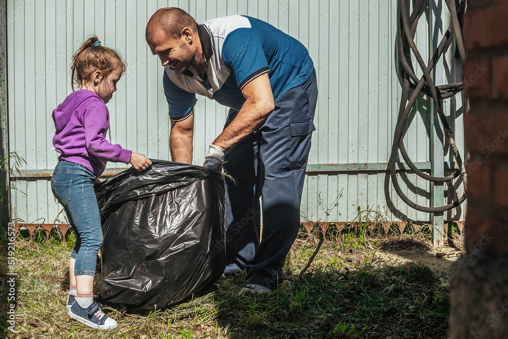 adults and children do household chores together, clean and tidy. dad ...