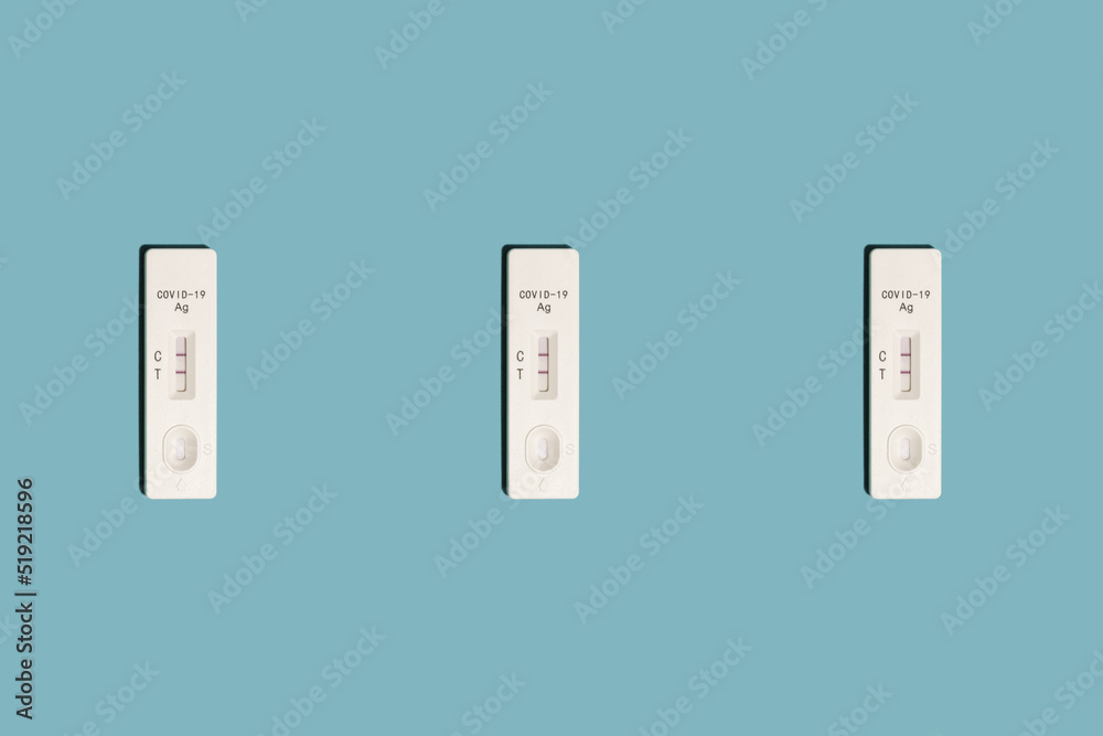 Positive Covid-19 antigen test pattern on light blue background with ...
