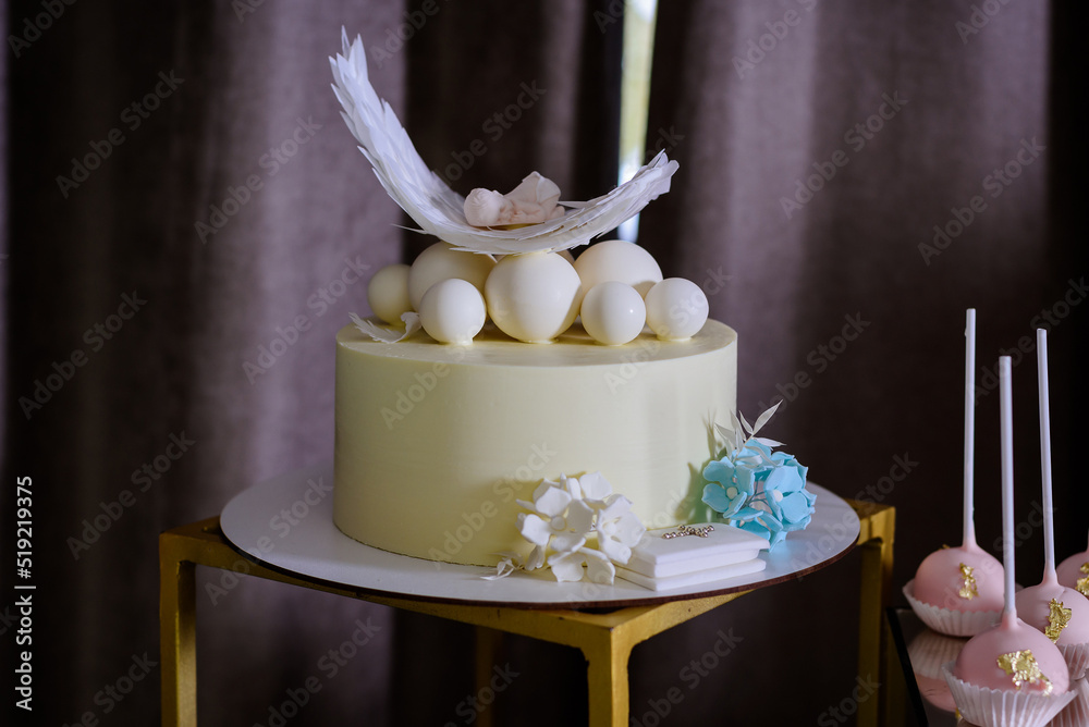 Christening cake for baby, cake with wings. Christening party candy bar Stock Photo | Adobe Stock