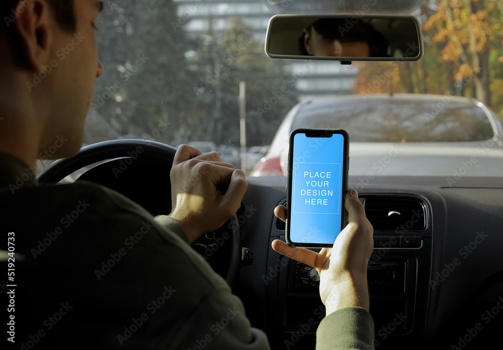 Mockup Man in the Car Watch on Phone Stock Template | Adobe Stock