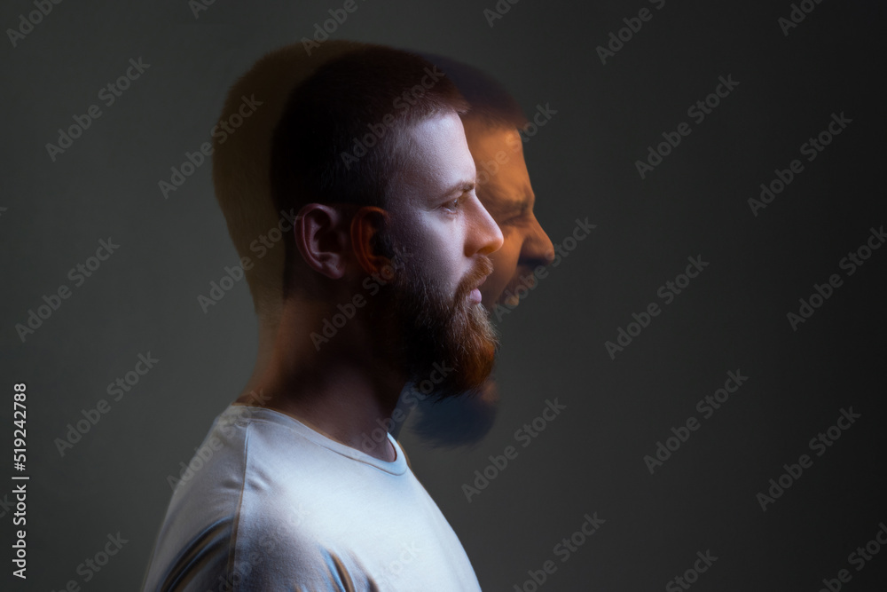 Side view portrait of two-faced man in calm serious and angry screaming ...