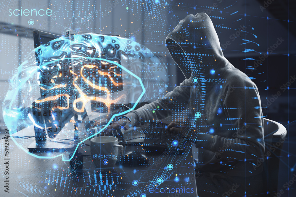 Hacker at desktop using laptop computer with creative brain hologram on ...