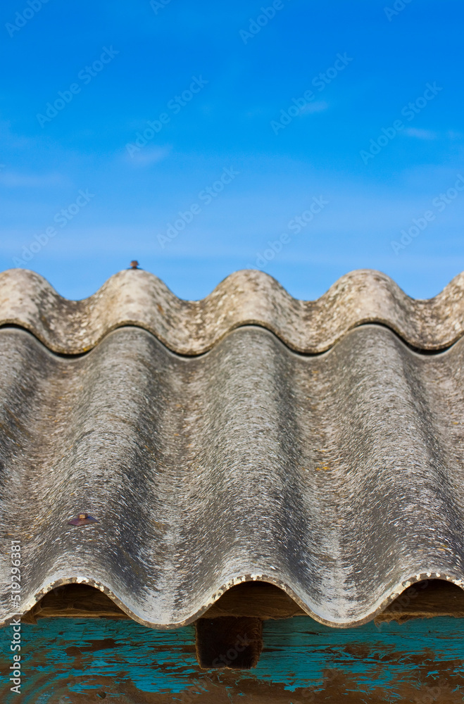 Old aged dangerous roof made of corrugated asbestos panels - one of the ...