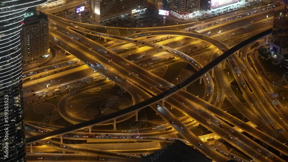 Multi-level illuminated road Burj Khalifa from bird eye view at night ...