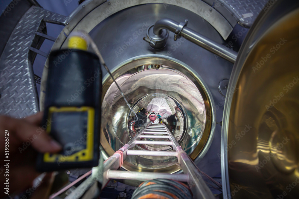 Worker hand holding gas detector inspection safety gas testing at front ...