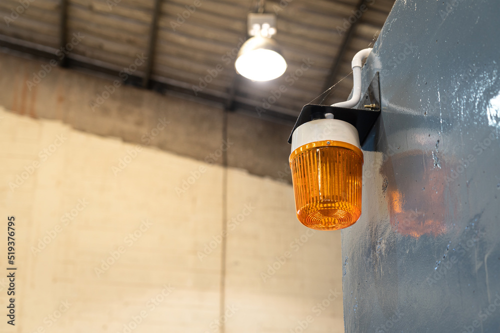 Poster Alert flashing light which is installed at factory area, using ...