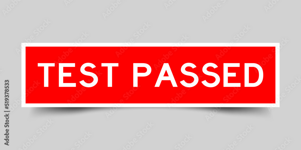 Red color square shape sticker label with word test passed on gray ...