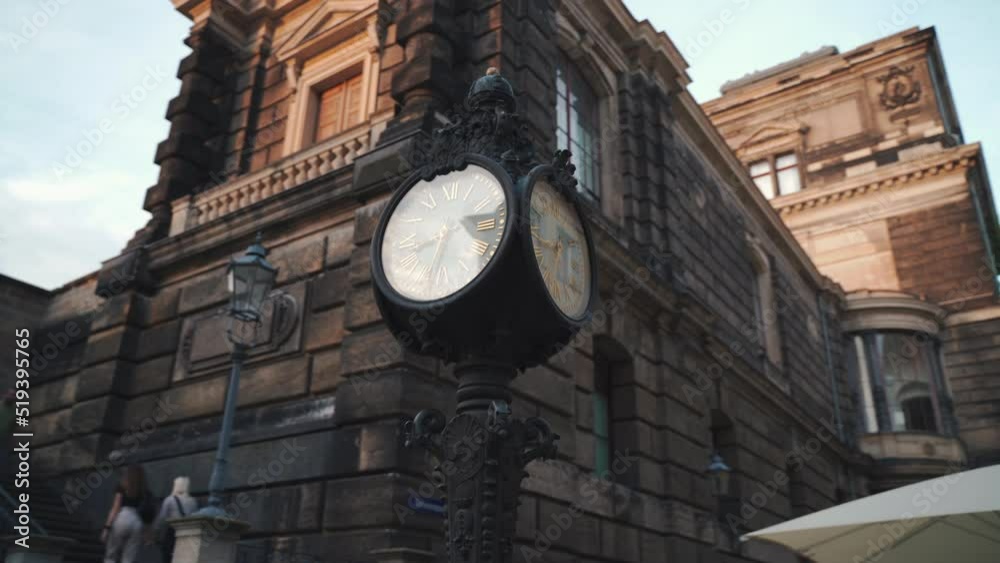 Walk around shot of a big historic clock in historic city center of ...
