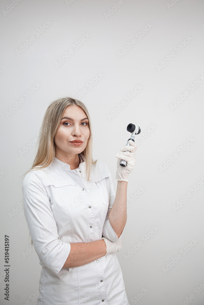 Portrait of blonde woman dermatologist with dermatoscope in white lab ...