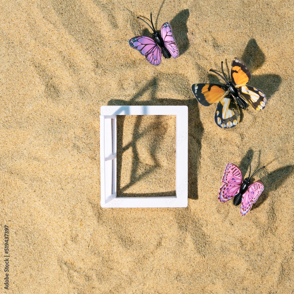 Trendy open window layout with butterflies on sandy beach with copy ...