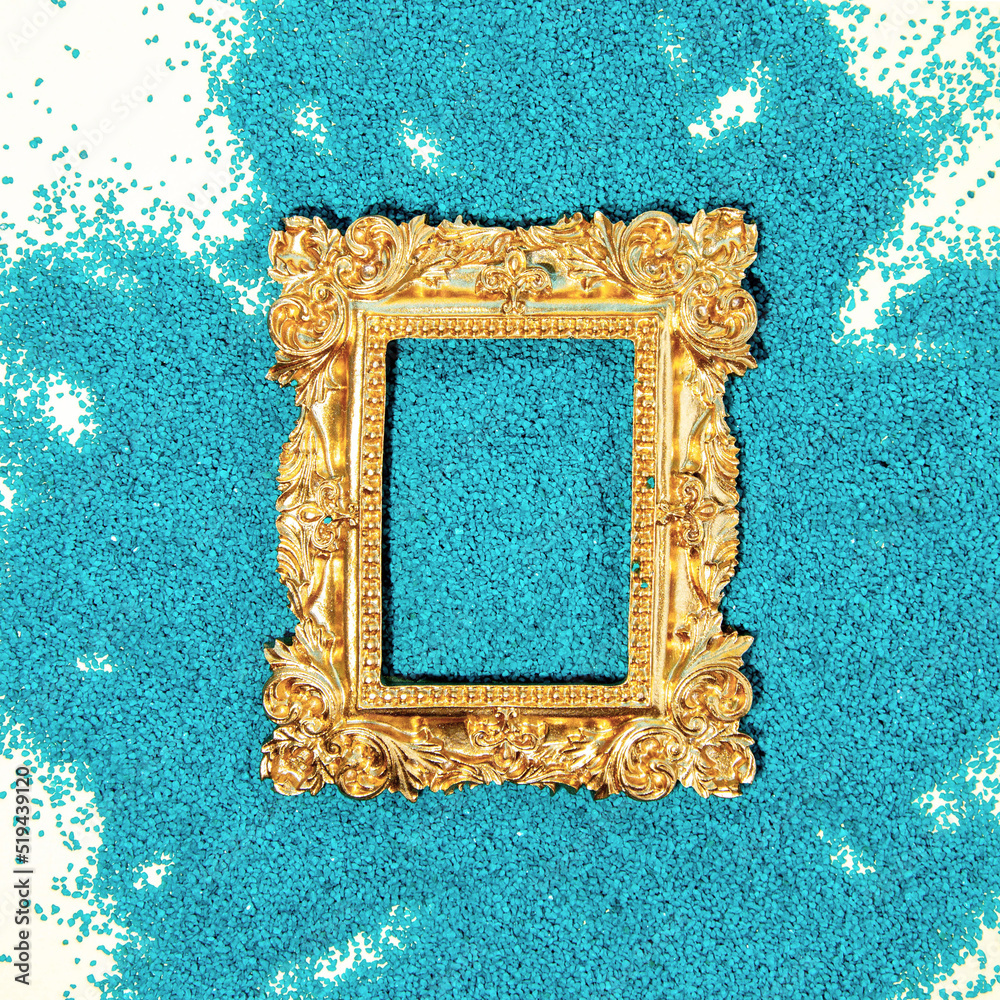 Modern gold frame in turquoise blue sand with copy space. Summer trendy ...