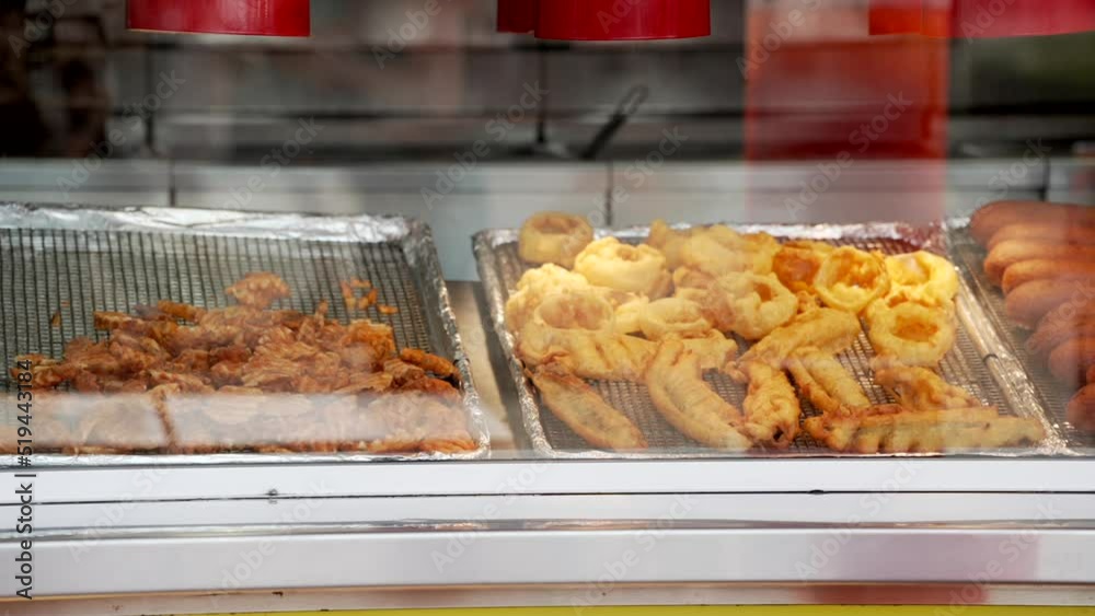 This panning video shows a delicious display of fried fair food on ...