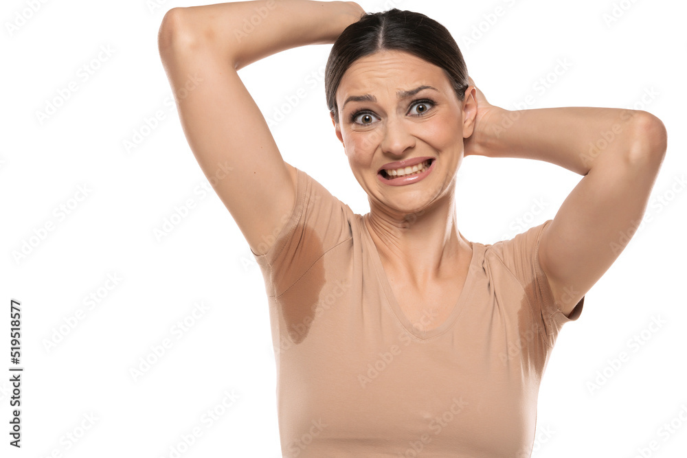 portrait of a beautiful embarrassed woman with sweaty armpits on a ...