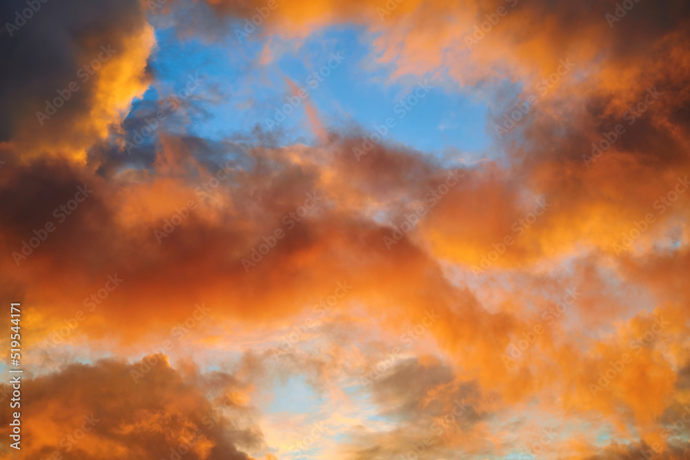 Yellow sunset sky with orange thunder clouds, thunderclouds. Nature sky ...