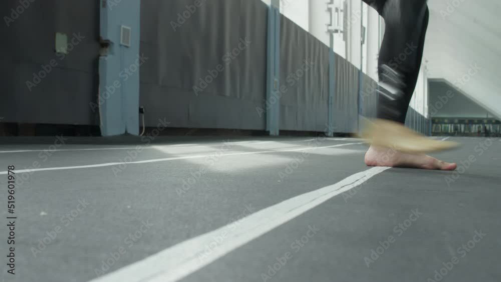 Ground level shot of legs of professional male athlete with prosthetic ...