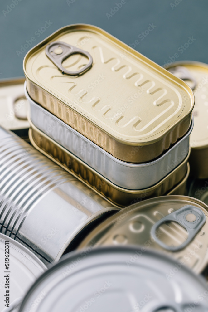 Row of cans on a blue background Stock Photo | Adobe Stock