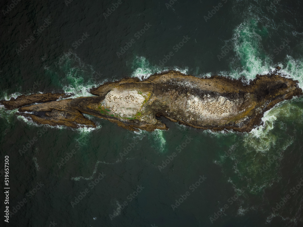 Shooting from a drone. Stone island, bizarre shape, in the middle of ...