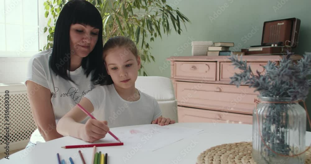 Vídeo do Stock: Caring young mum or nanny helping cute kid daughter ...