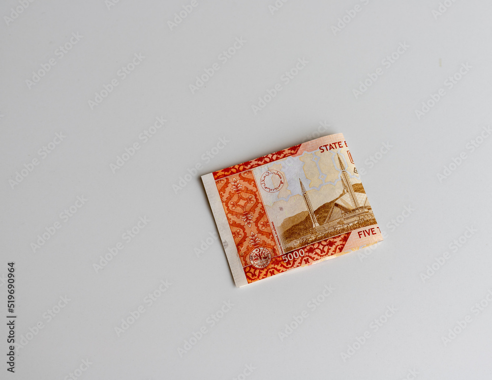 Pakistani currency bank note of 5000 rupees half folded isolated on ...