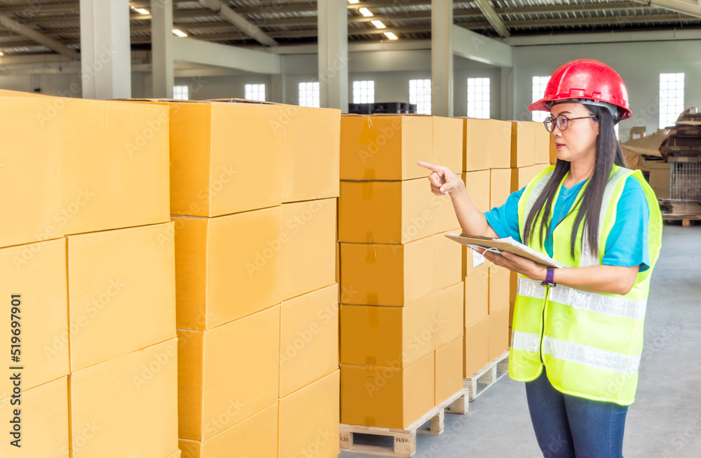 Warehouse worker inspecting checklist cargo shipment and checks ...