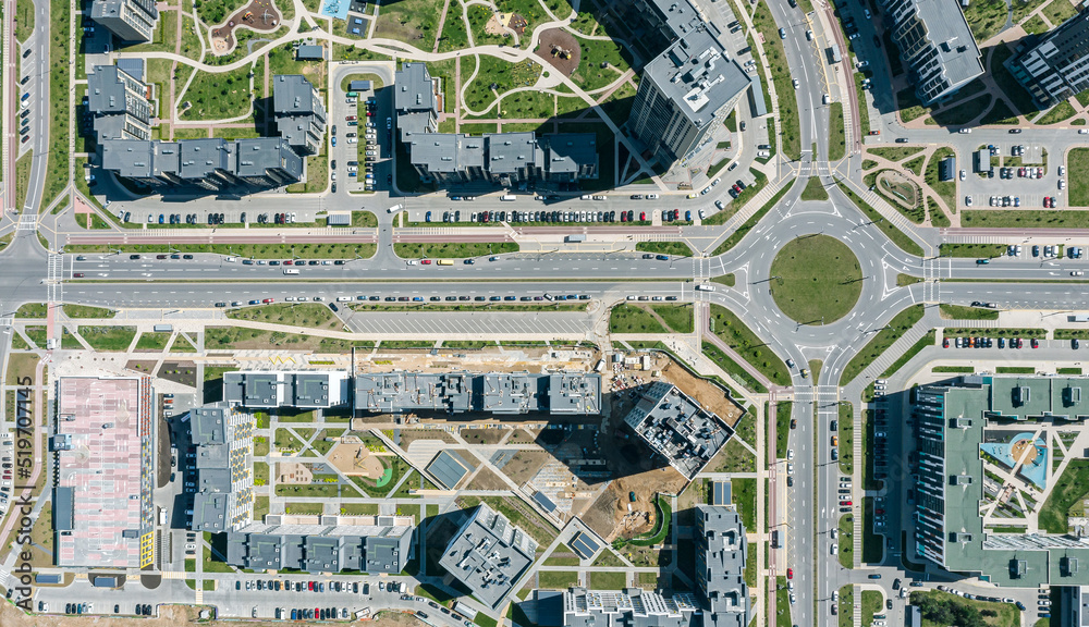 aerial top view of urban apartment houses and streets with roundabout ...