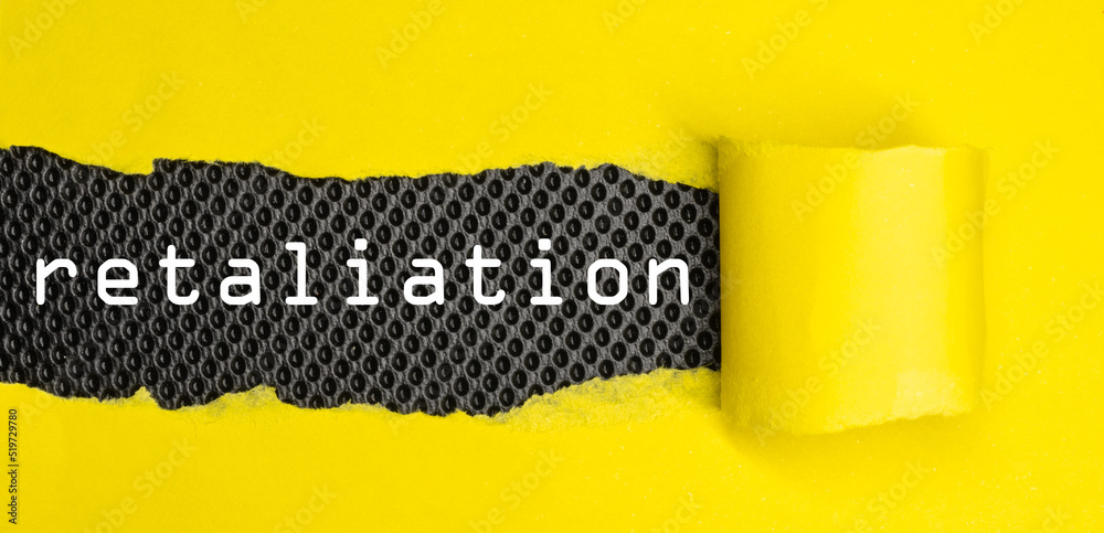 Retaliation. Word written yellow cardboard under modern black ...