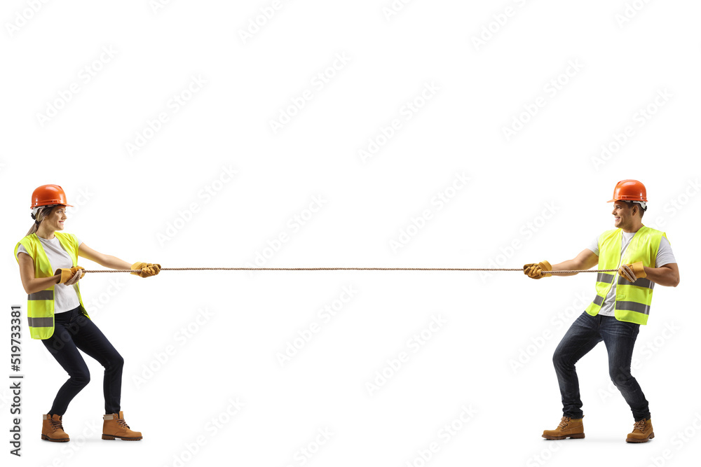 Full length profile shot of a male and female construction worker ...