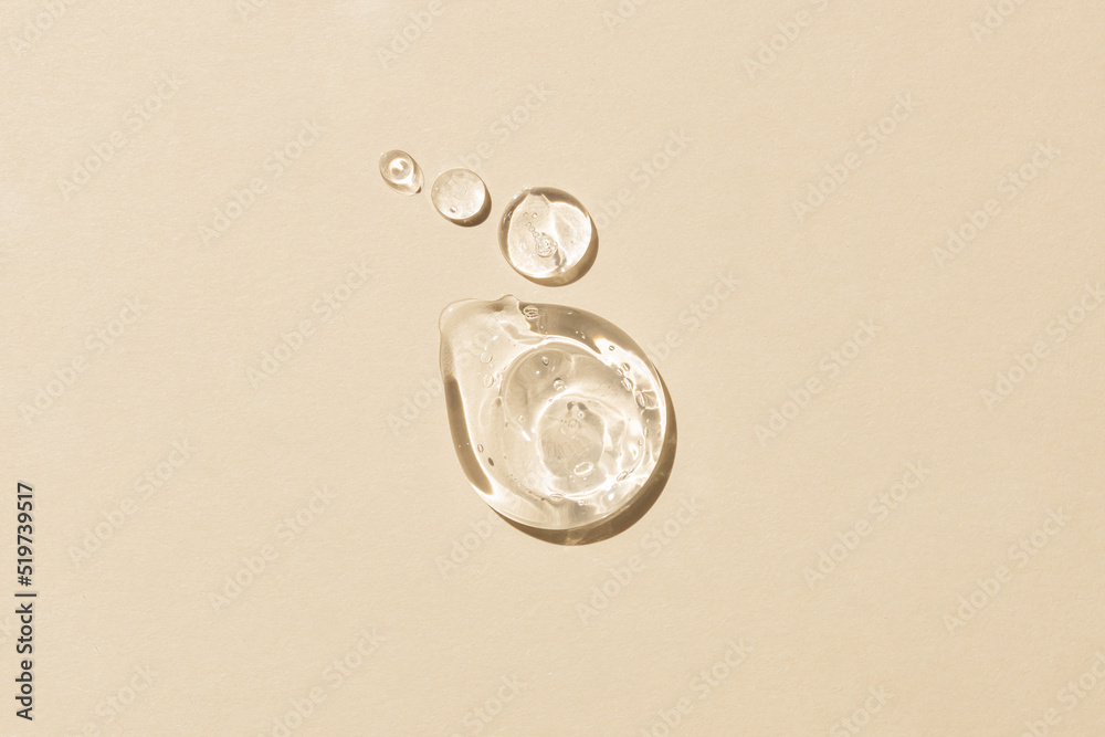 Glycerin gel texture. Transparent serum drop on beige background ...